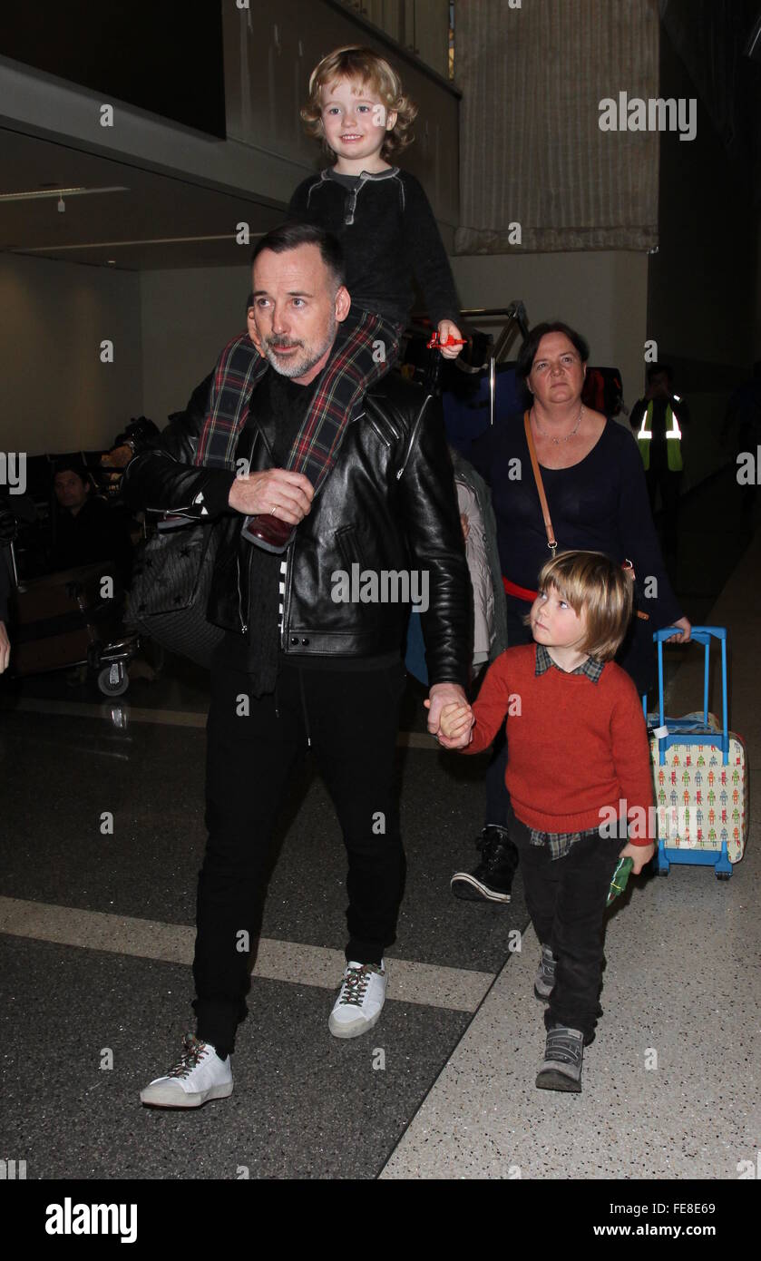 David Furnish departs on a flight from Los Angeles International ...
