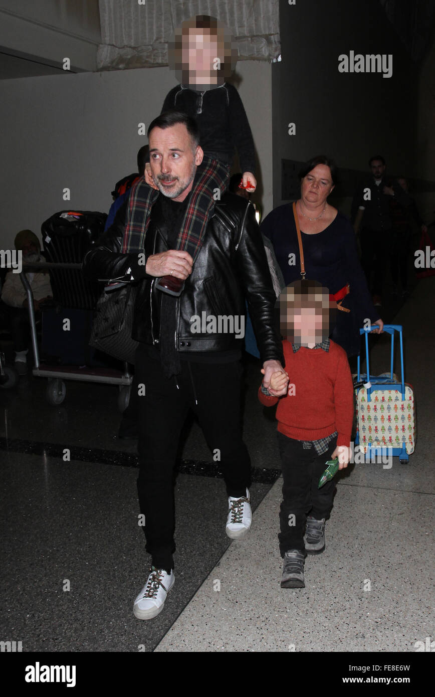 David Furnish departs on a flight from Los Angeles International ...