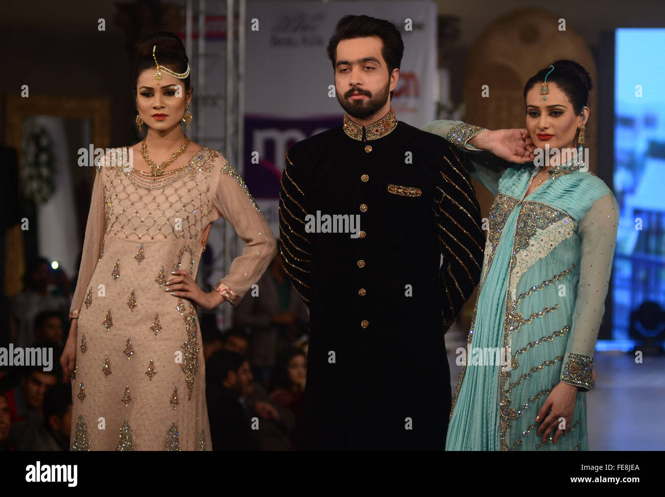 Lahore, Pakistan. 04th Feb, 2016. Pakistani models present the creation ...