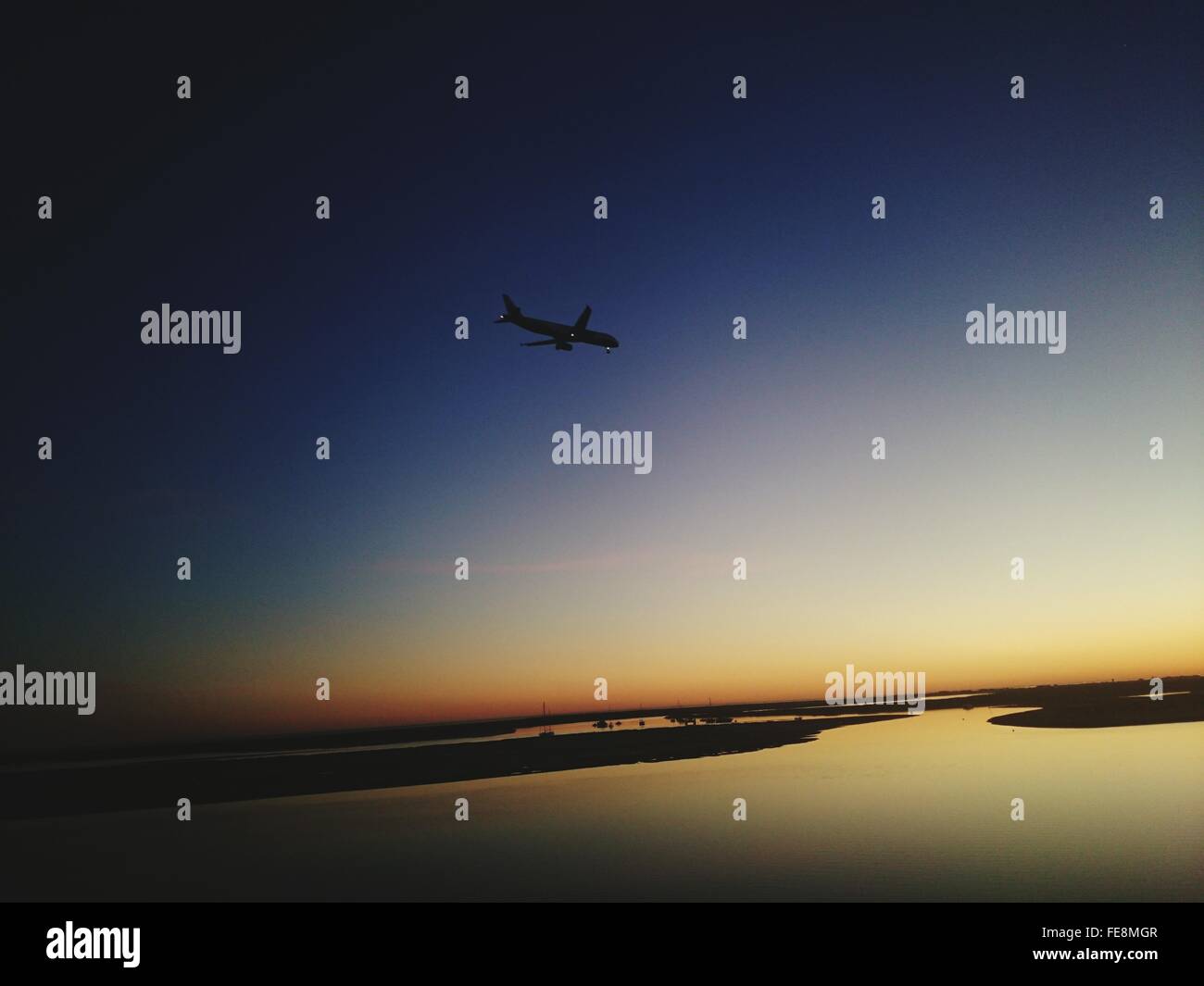 Aircraft is flying low over the beach hi-res stock photography and ...