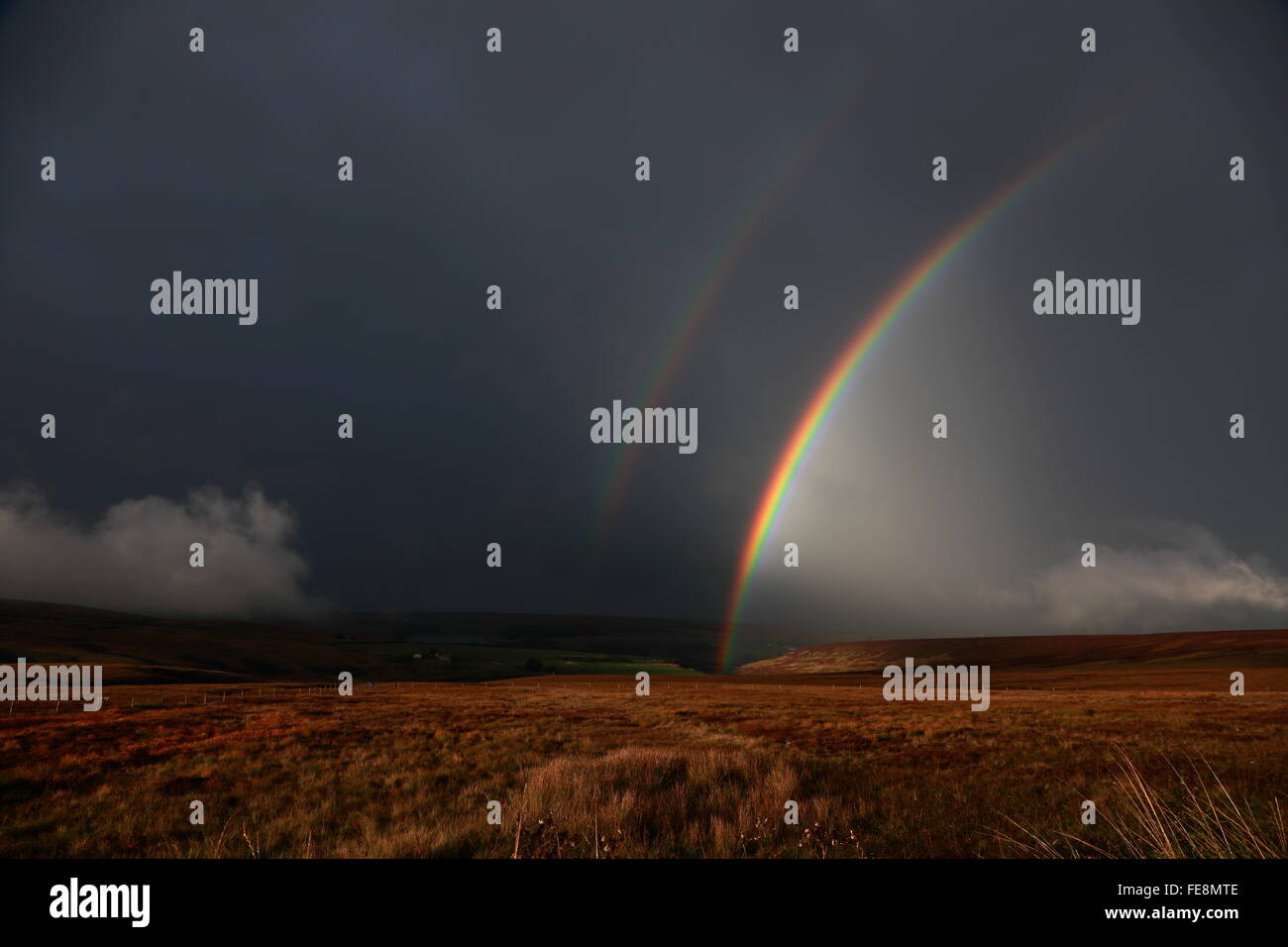 Rainbow between dark clouds hi-res stock photography and images - Alamy