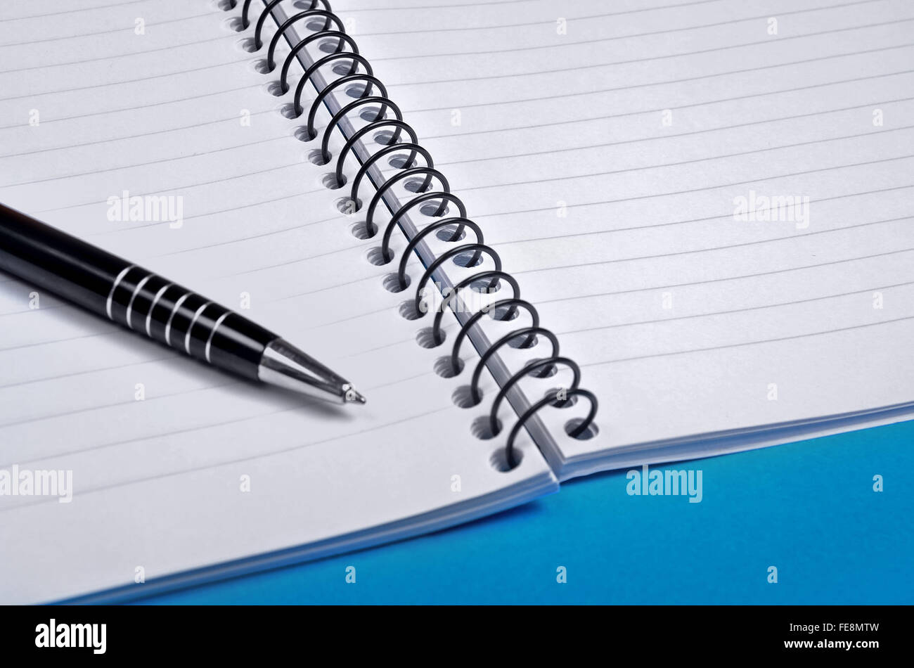 Pen and notebook on background Stock Photo - Alamy