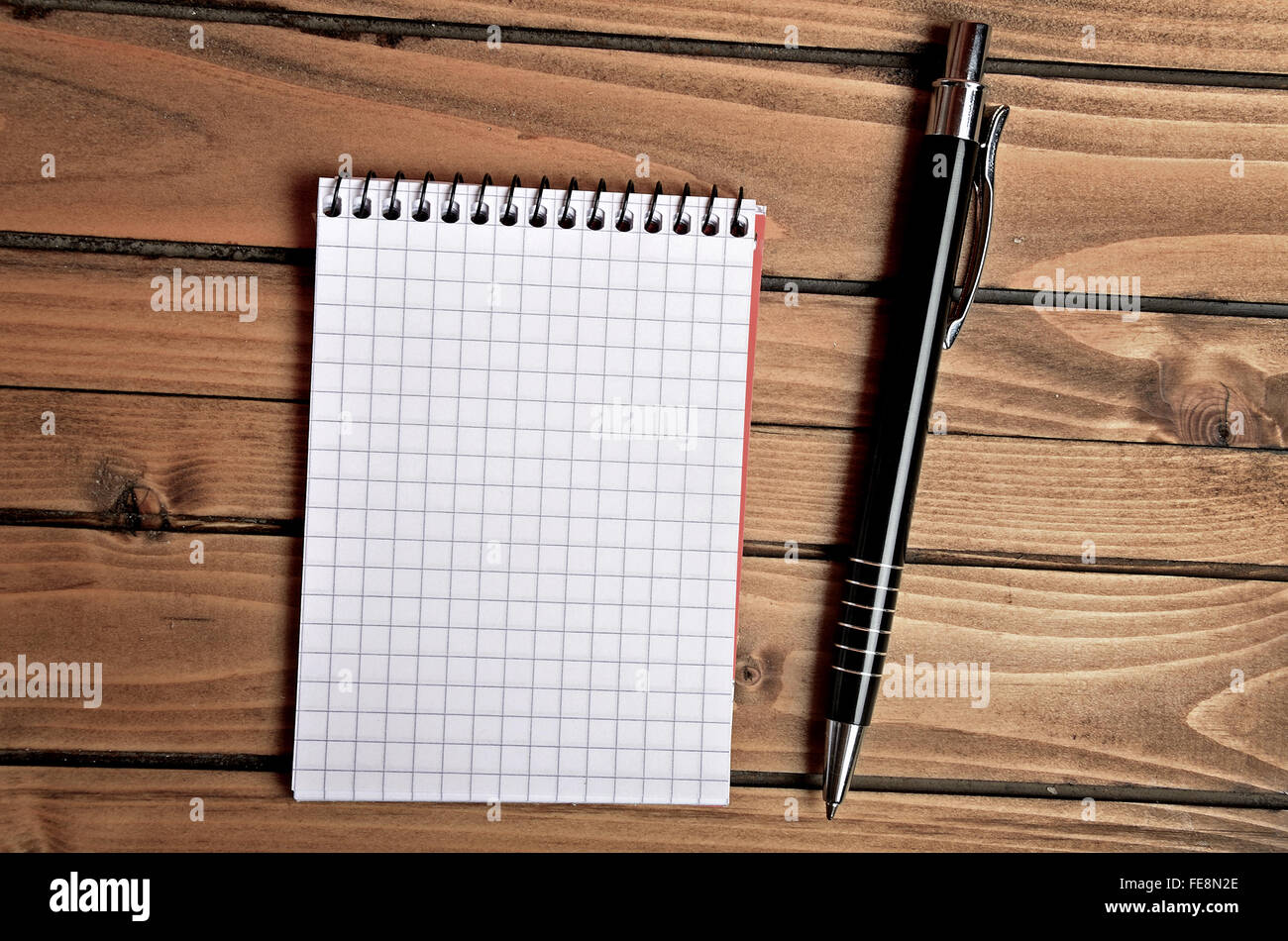 Empty notepad and pen on table Stock Photo - Alamy