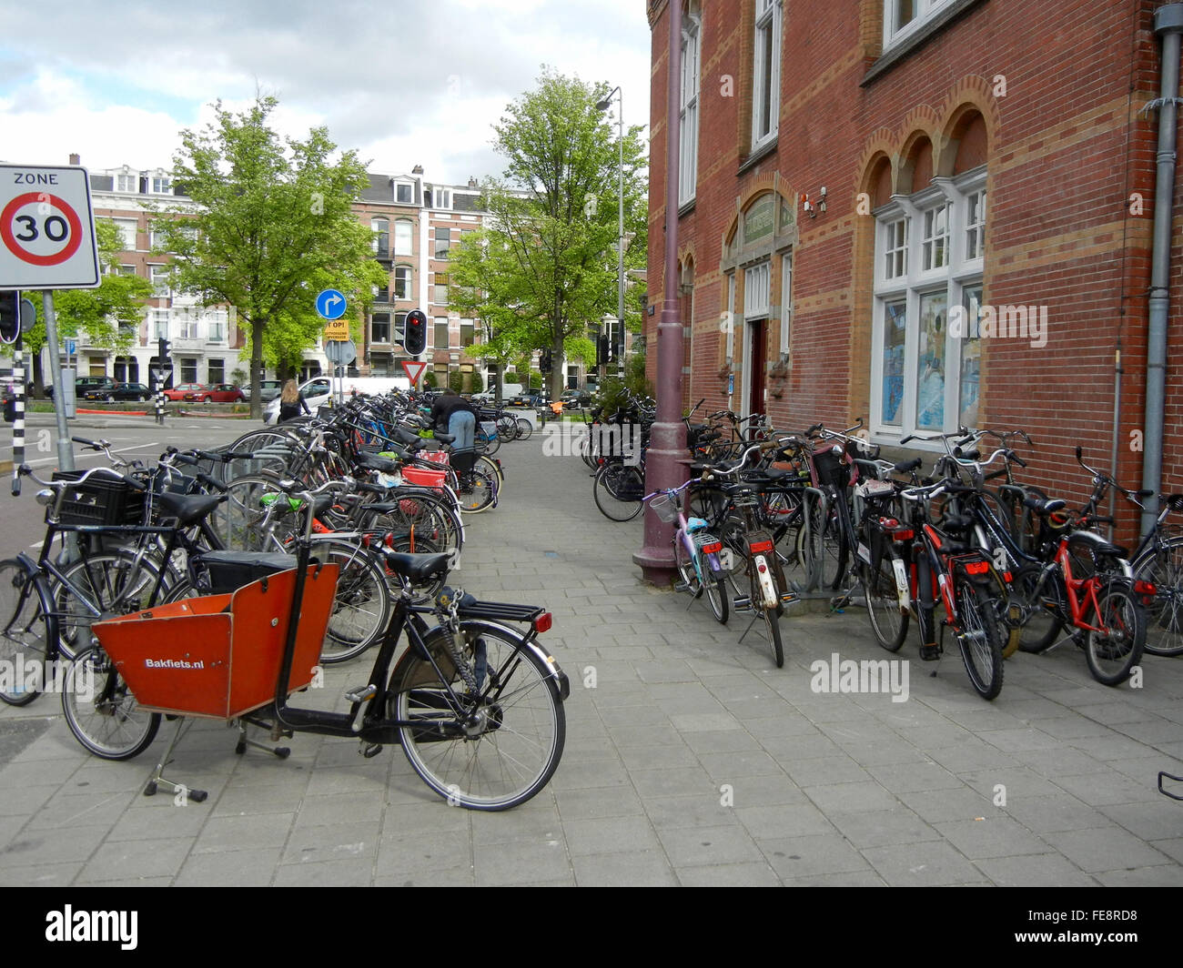 Bicycles on sidewalk in Amsterdam Stock Photo - Alamy