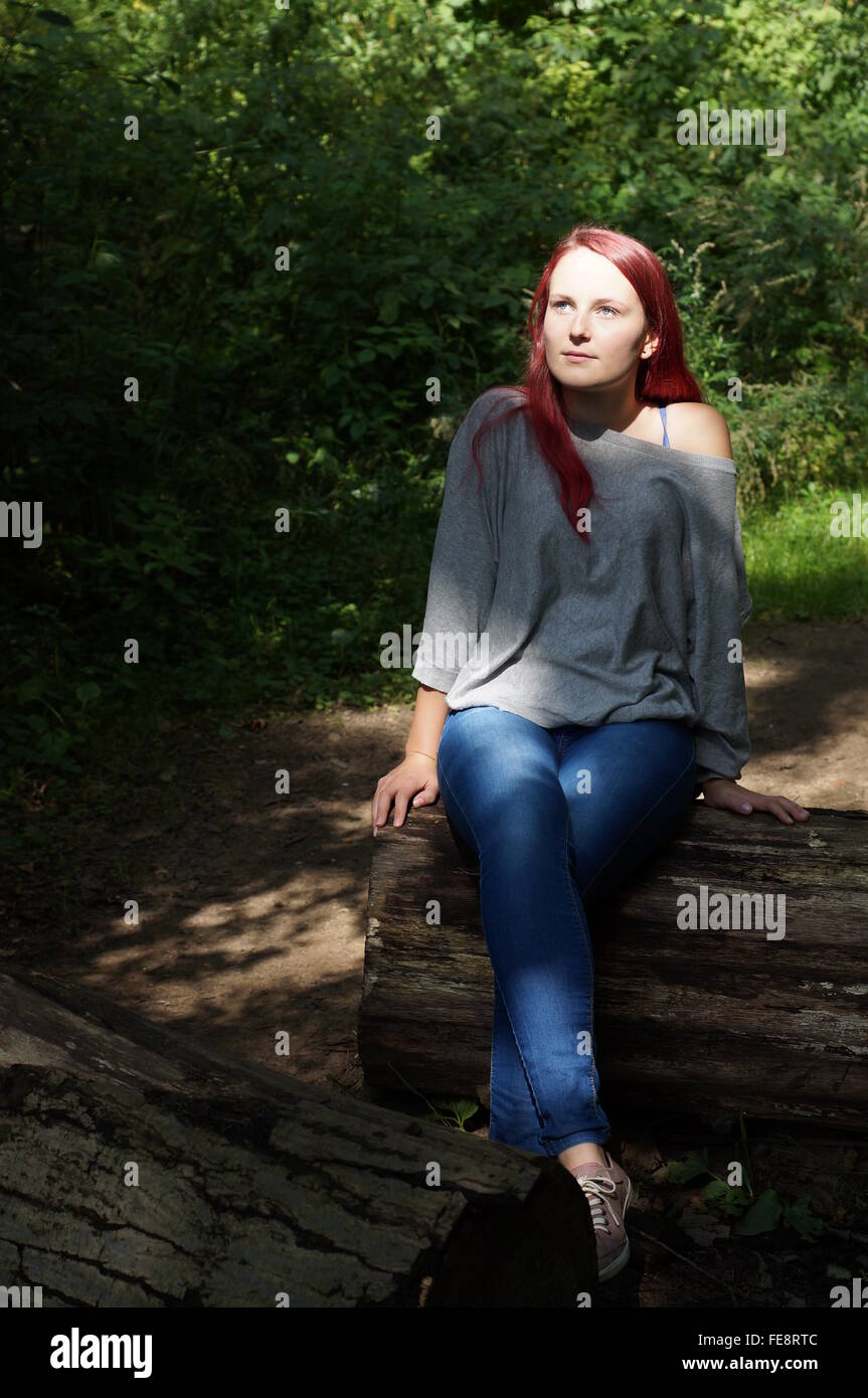 Woman Sitting On Log High Resolution Stock Photography and Images - Alamy