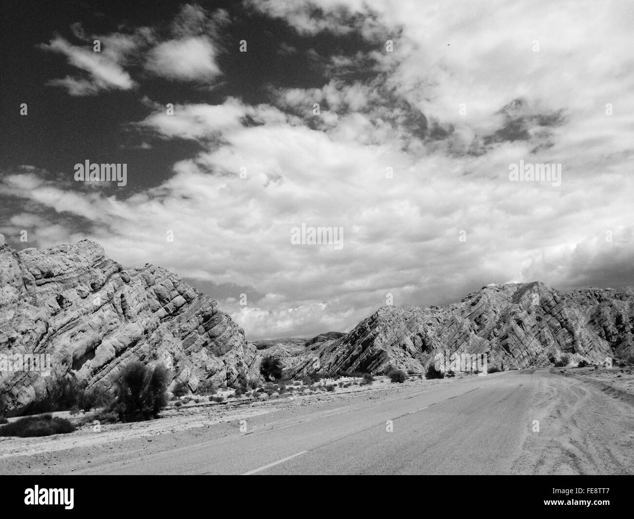 Rocks By Road Stock Photo - Alamy