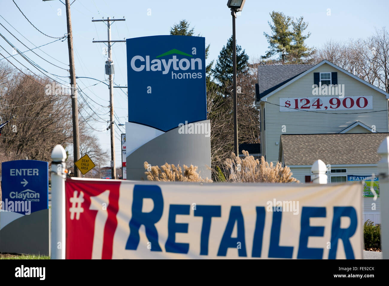 A logo sign outside of Clayton Homes retail location in Lancaster ...