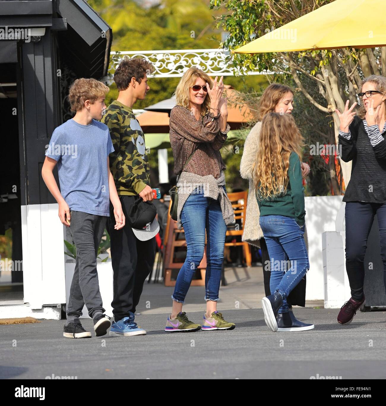 Laura Dern having lunch with a family. Featuring: Laura Dern, Jaya ...