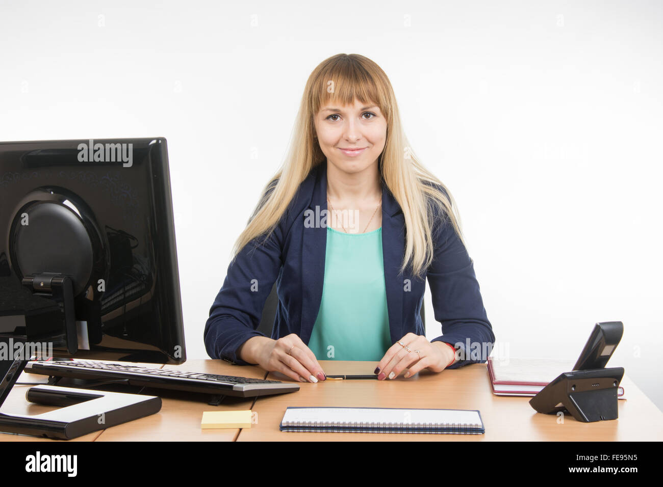 Attractive blonde secretary sitting desk hi-res stock photography and ...