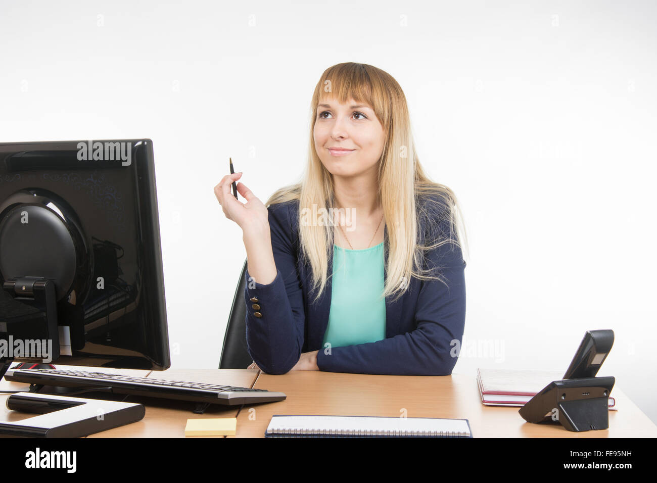 Young business woman secretary sitting at office desk working, isolated ...