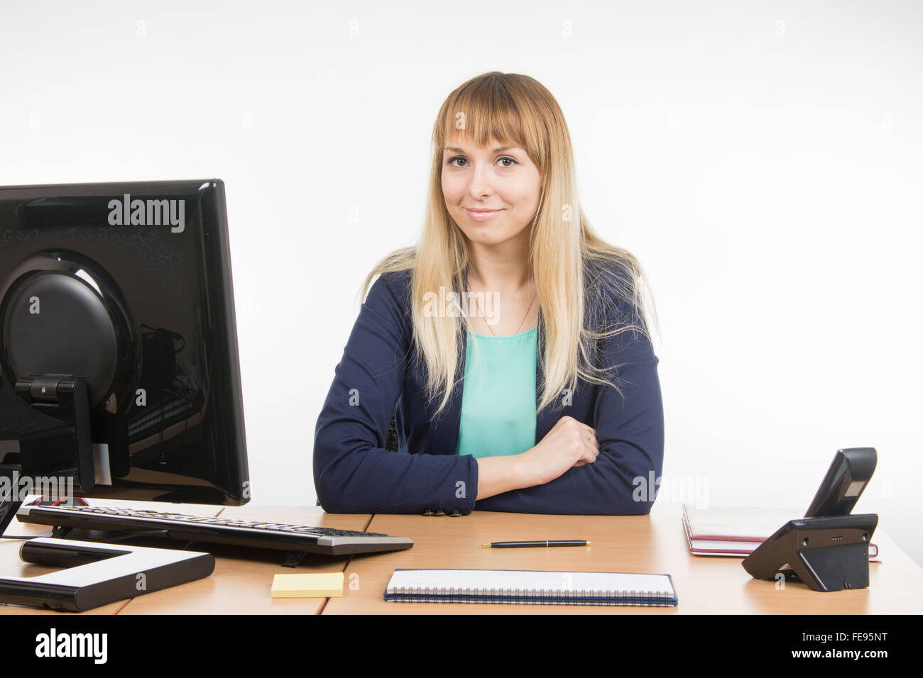 Young business woman secretary sitting at office desk working, isolated ...