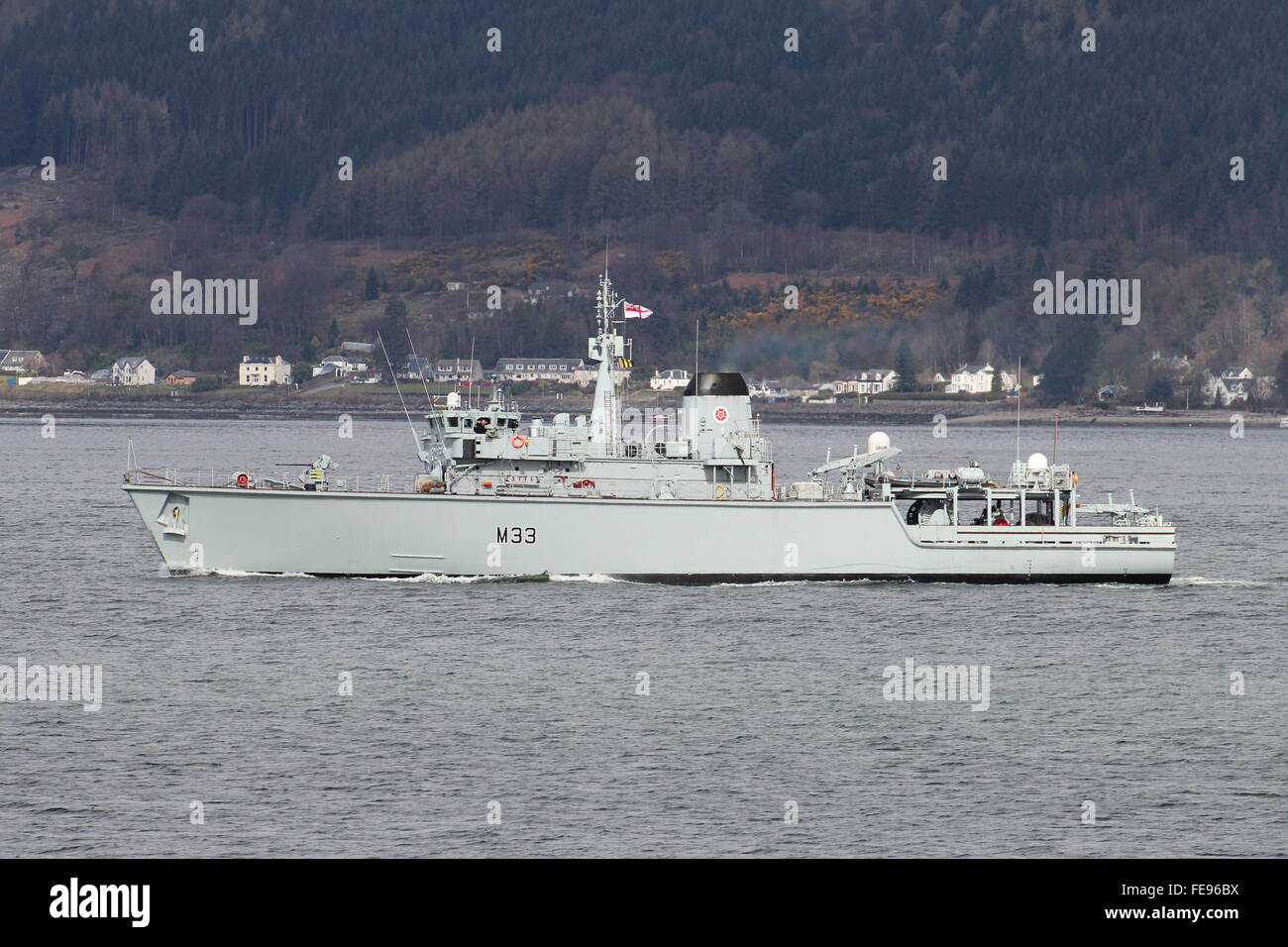 HMS Brocklesby (M33), a Hunt-class minehunter of the Royal Navy, heads ...