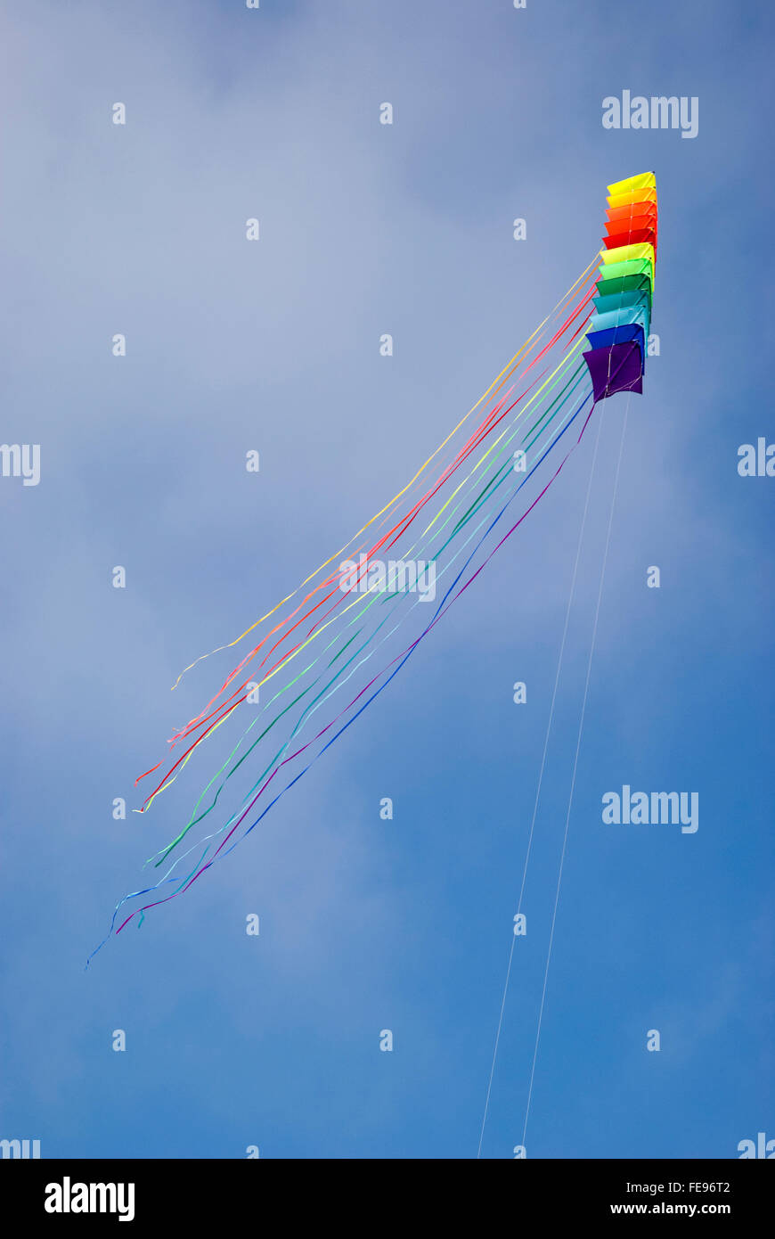 Kite flying in blue sky Stock Photo - Alamy