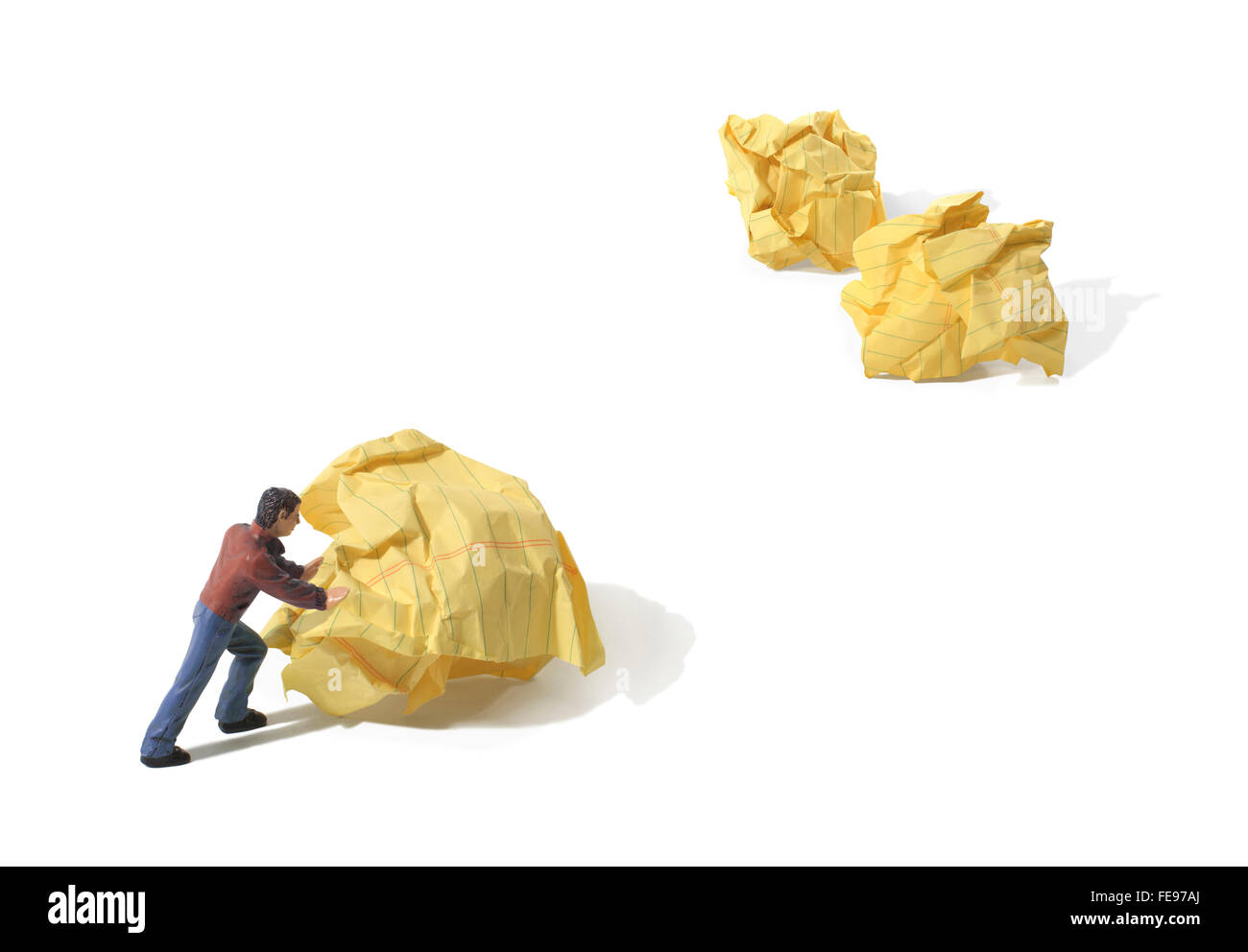 Figure Pushing a Yellow Crumpled Paper Wad on a White Background Stock ...