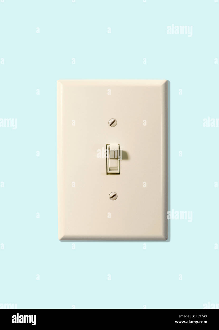 Electrical Wall Switch on a Blue Background Stock Photo - Alamy