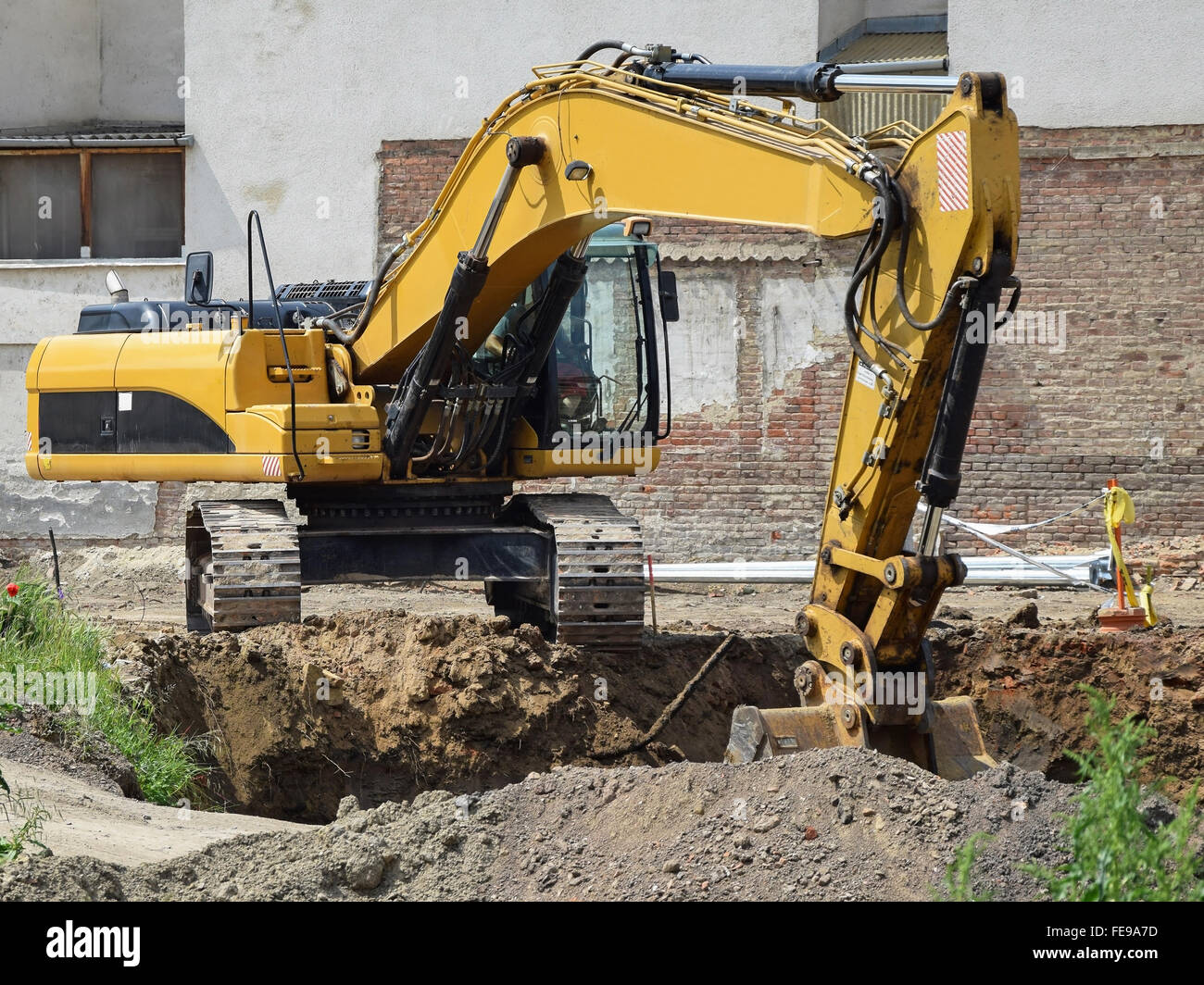 Excavator at the road construction Stock Photo - Alamy