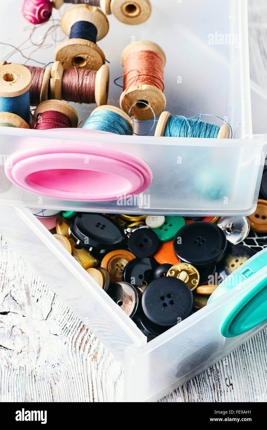 Two plastic sewing box with threads and buttons.Selective focus Stock ...