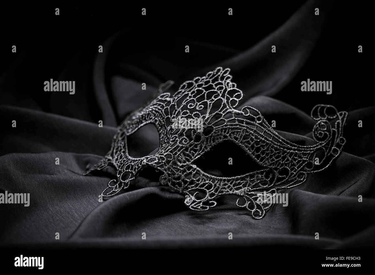 Black crochet carnival mask on dark background Stock Photo - Alamy