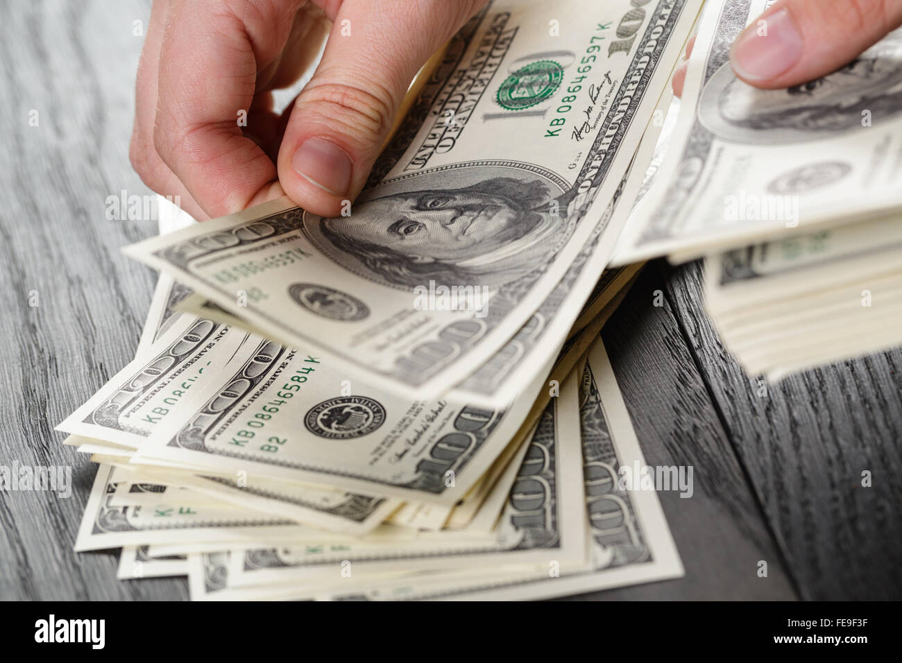 Businesswoman hands count dollar bills hi-res stock photography and ...