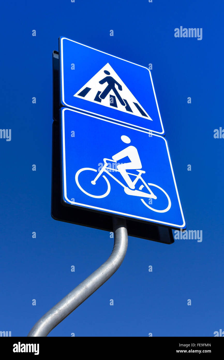 Road Sign Warns About Pedestrian Crossing And Bicycle Road Stock Photo road-sign-warns-about-pedestrian-crossing-and-bicycle-road-stock-photo