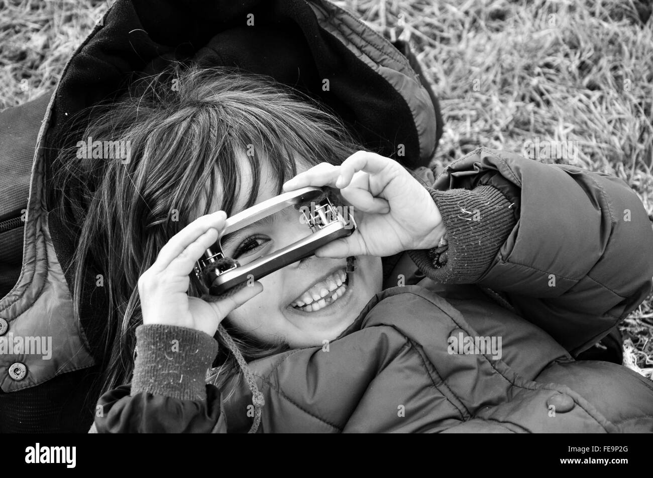Young girl gestures an outdoor shooting with a strange object Stock ...