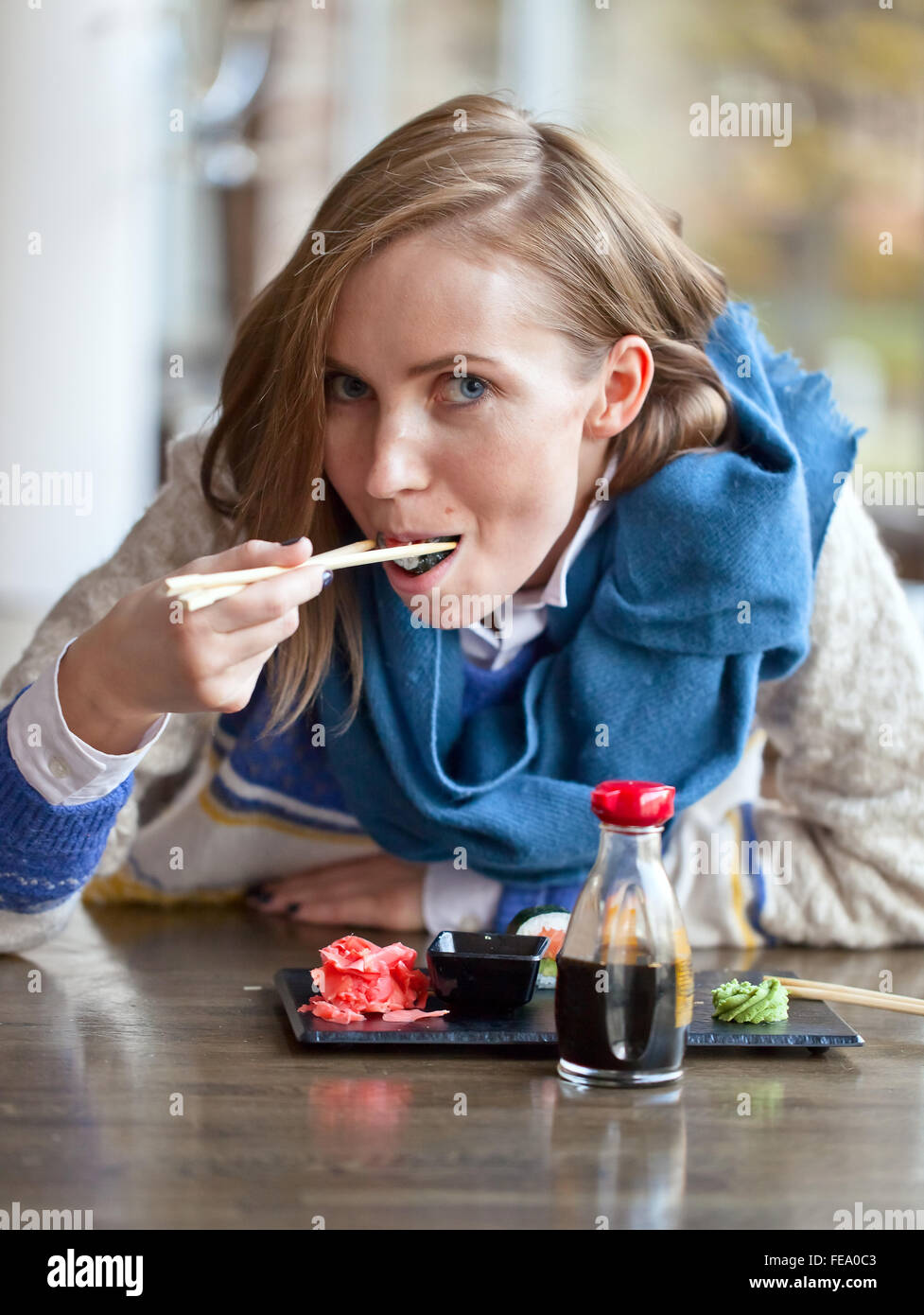 Woman eating rice vertical hi-res stock photography and images - Alamy