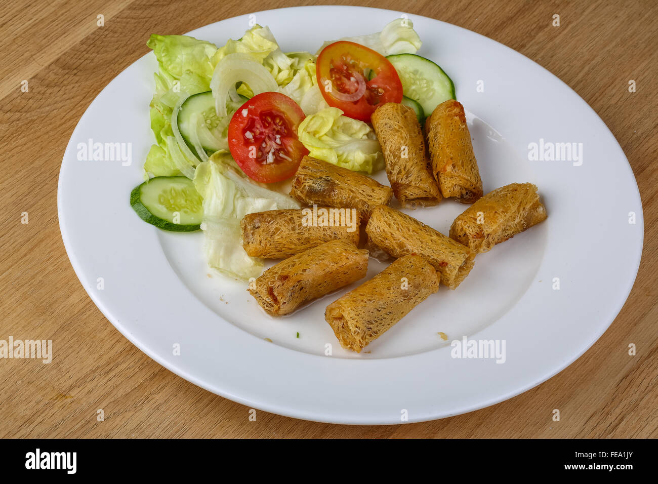 Asian traditional spring rolls on the wood background Stock Photo - Alamy