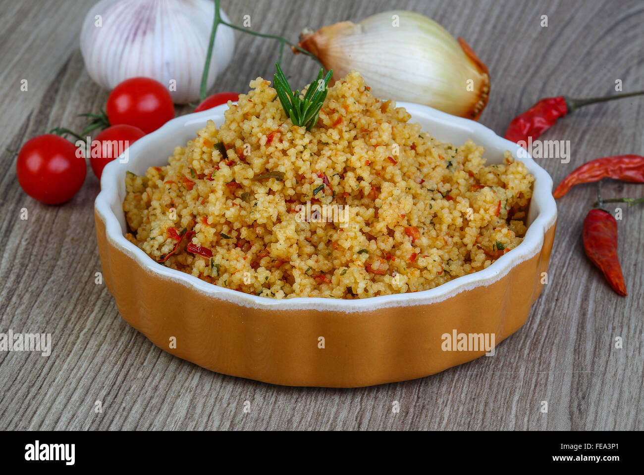 Arabic traditional cuisine - Couscous with tomato and green onion Stock ...
