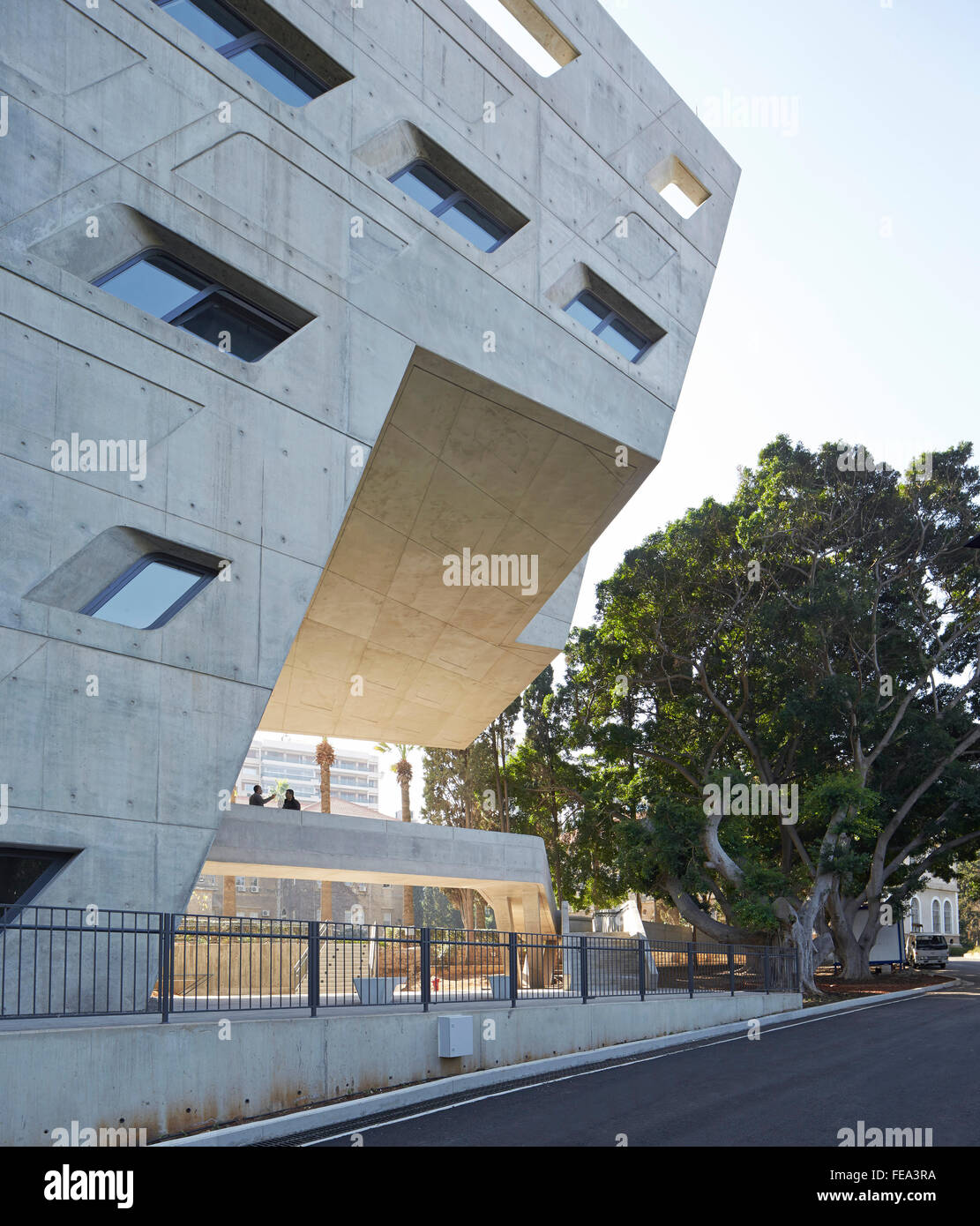 Bold concrete facade viewed from below. Issam Fares Institute, Beirut ...