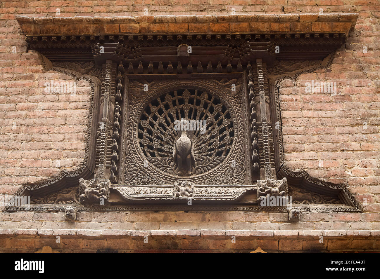 Wooden peacock window Stock Photo - Alamy
