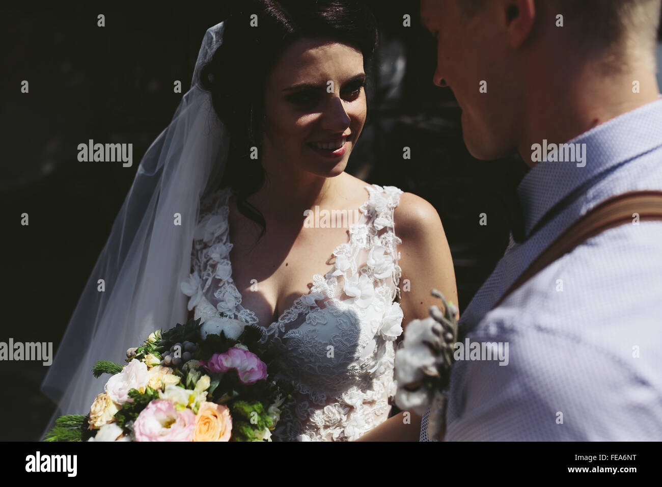 bride and groom posing on the streets of the old town Stock Photo - Alamy