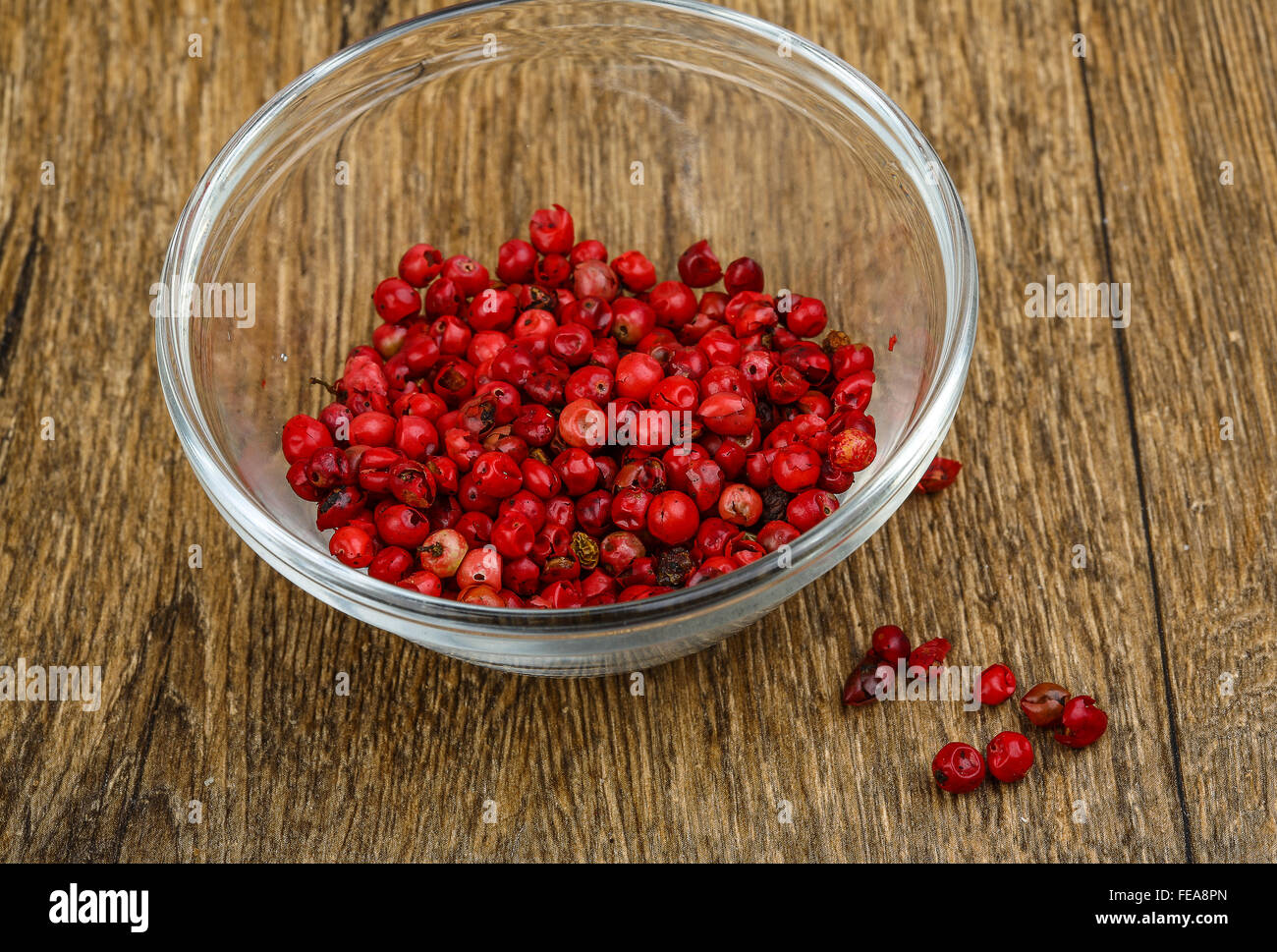 Dry Rose pepper corn on the wood background Stock Photo - Alamy