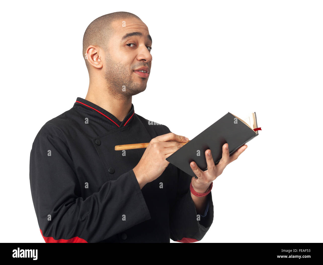 Young handsome cook holding hi-res stock photography and images - Alamy
