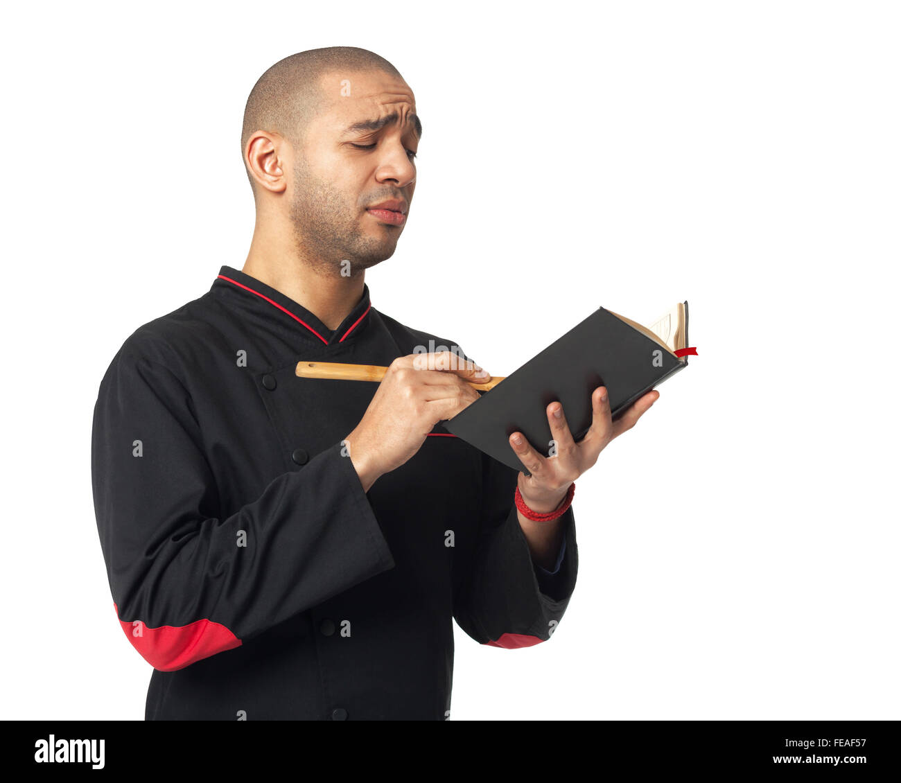 Afro American professional cook holding cookbook - isolated on white ...