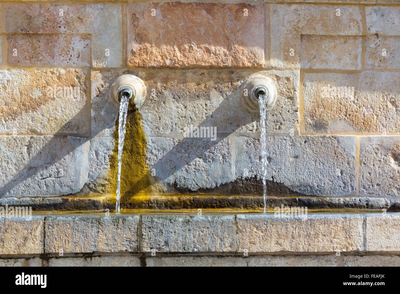 ancient water fountain water pipes Stock Photo - Alamy