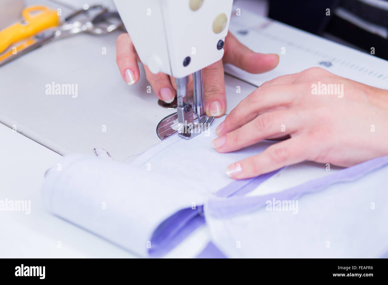 Women using sewing machine close hi-res stock photography and images ...