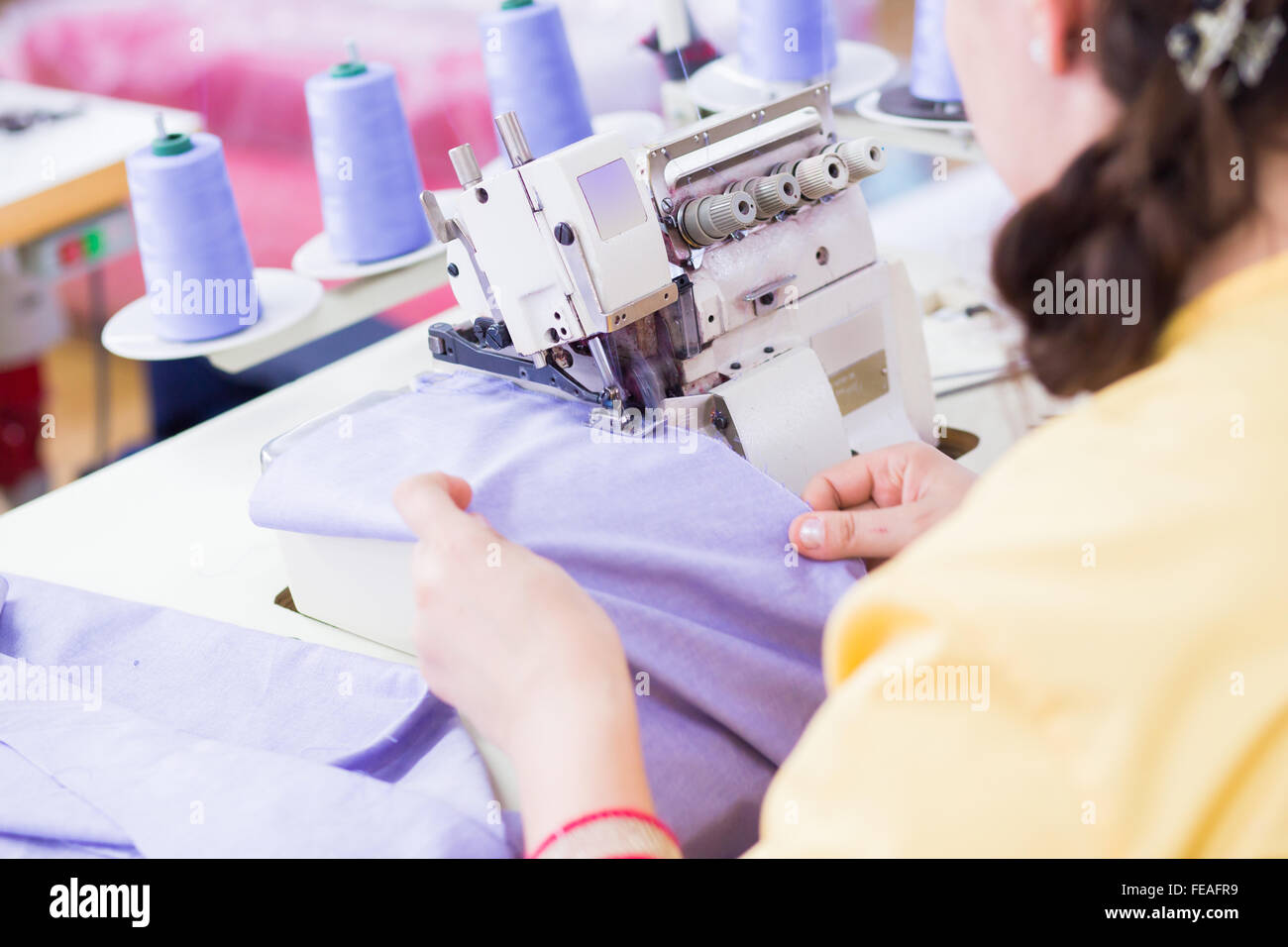 Tailor using sewing machine Stock Photo - Alamy