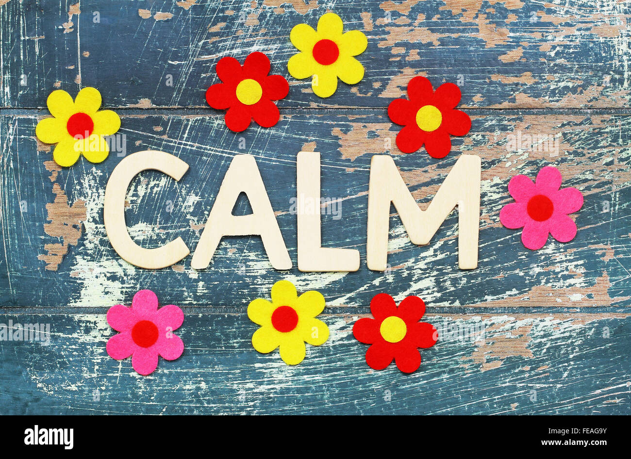Word calm written with wooden letters on rustic surface and colorful ...