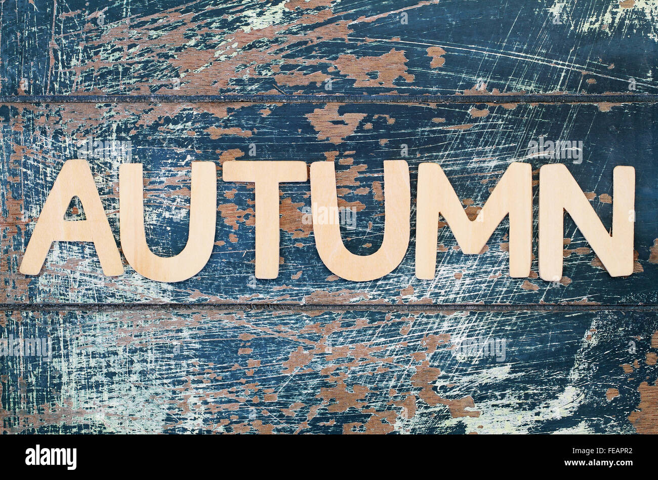 Word autumn written with wooden letters on rustic surface Stock Photo ...