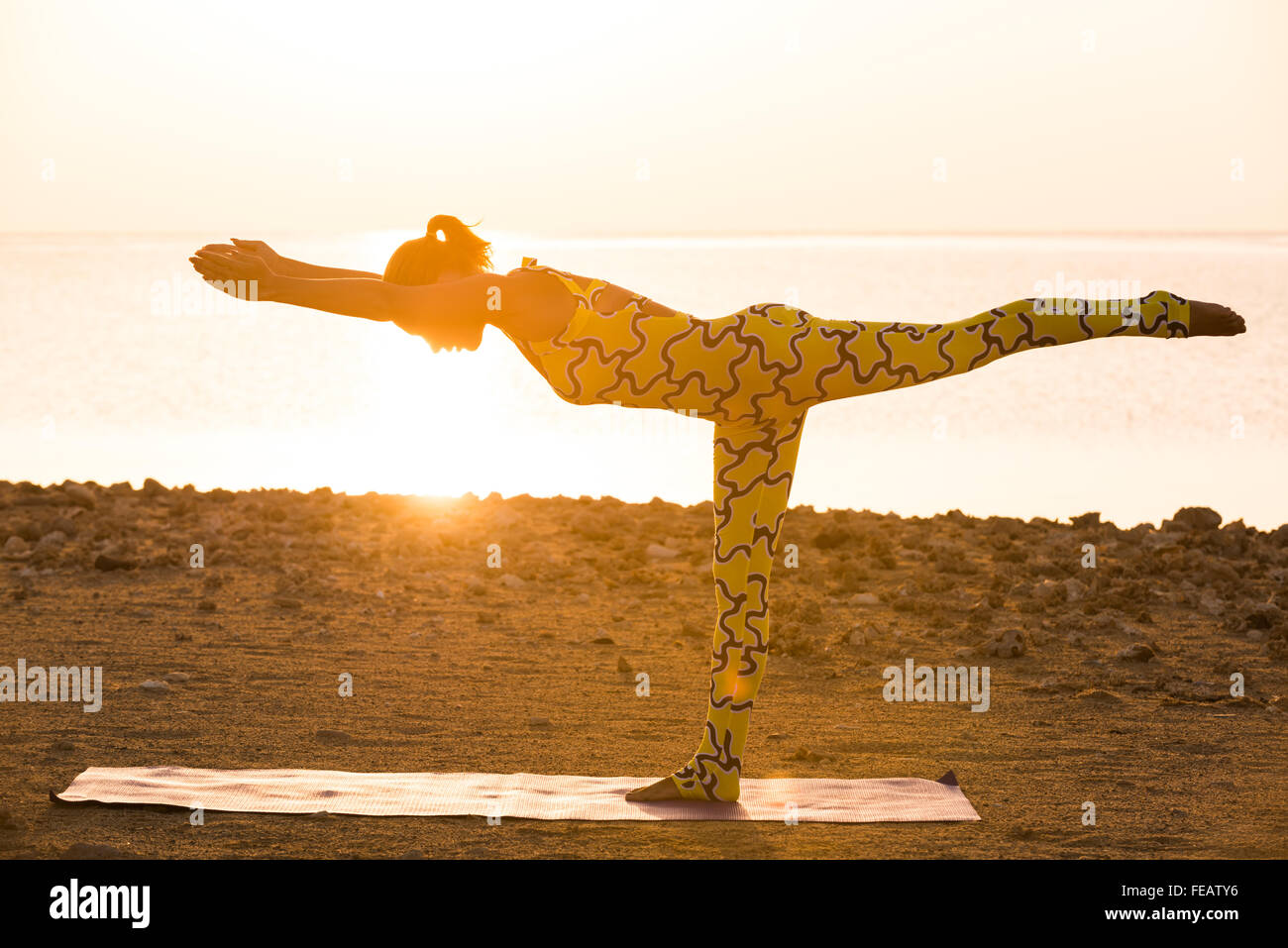 Yoga practice at sunrise Stock Photo - Alamy