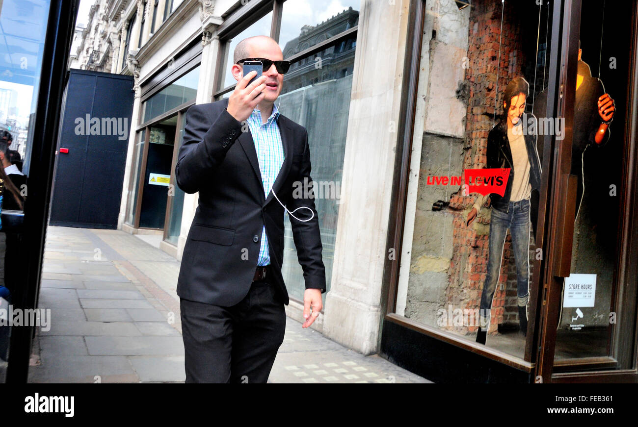 London, England, UK. Man walking and talking on a mobile phone Stock ...