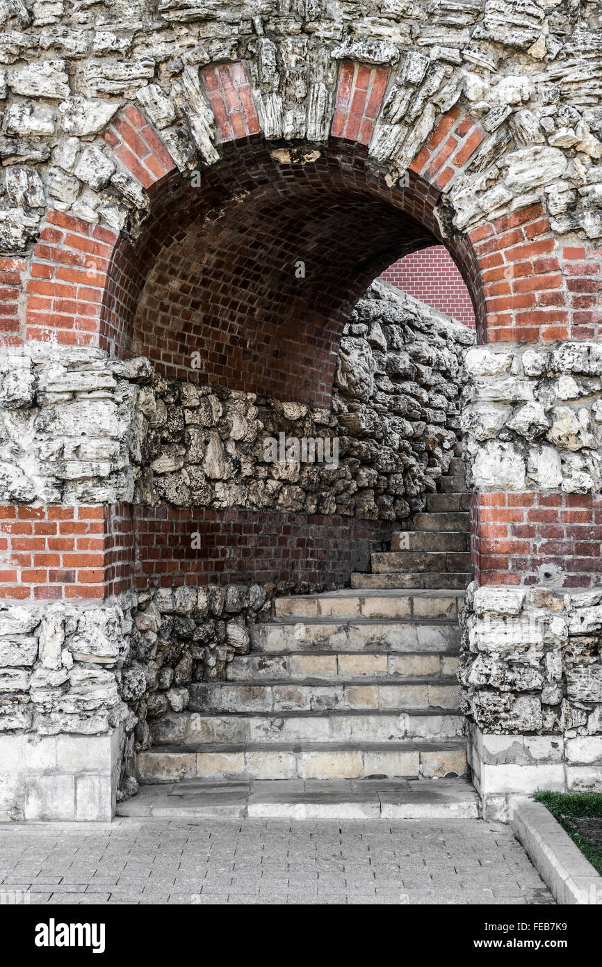 Arch in stone wall Stock Photo - Alamy