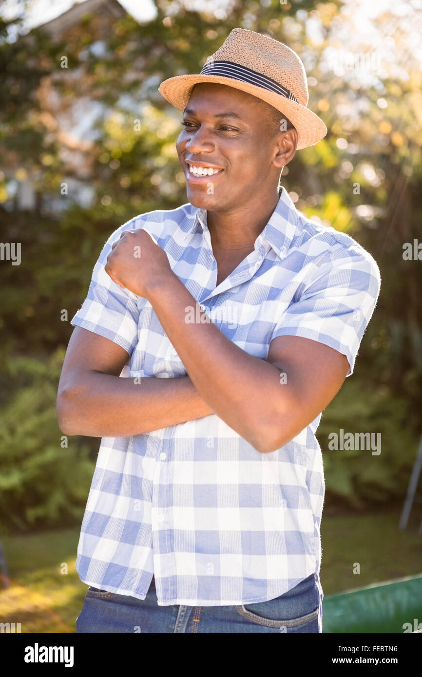 Handsome man wearing straw hat Stock Photo - Alamy