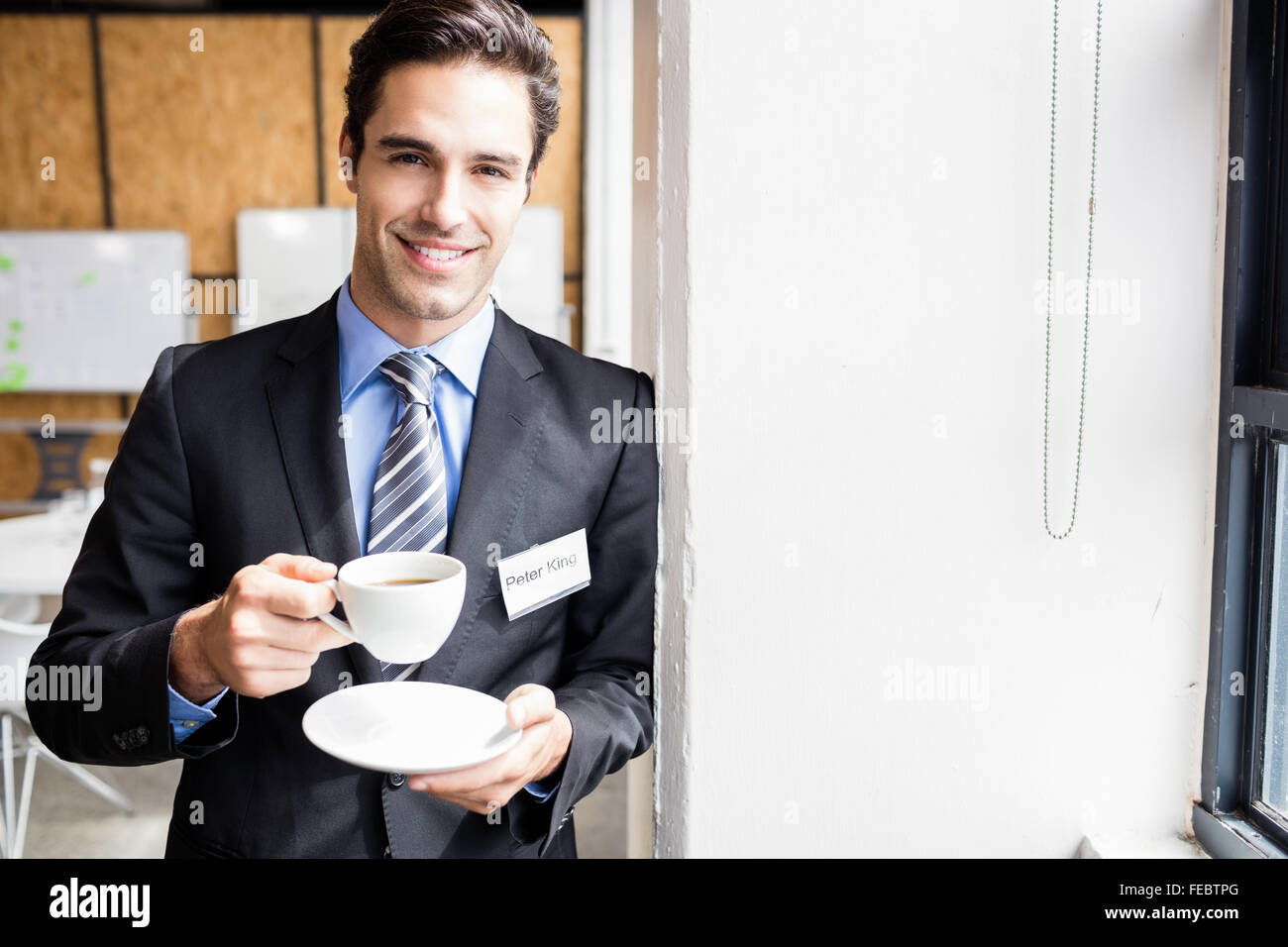 Businessman smiling at conference Stock Photo - Alamy