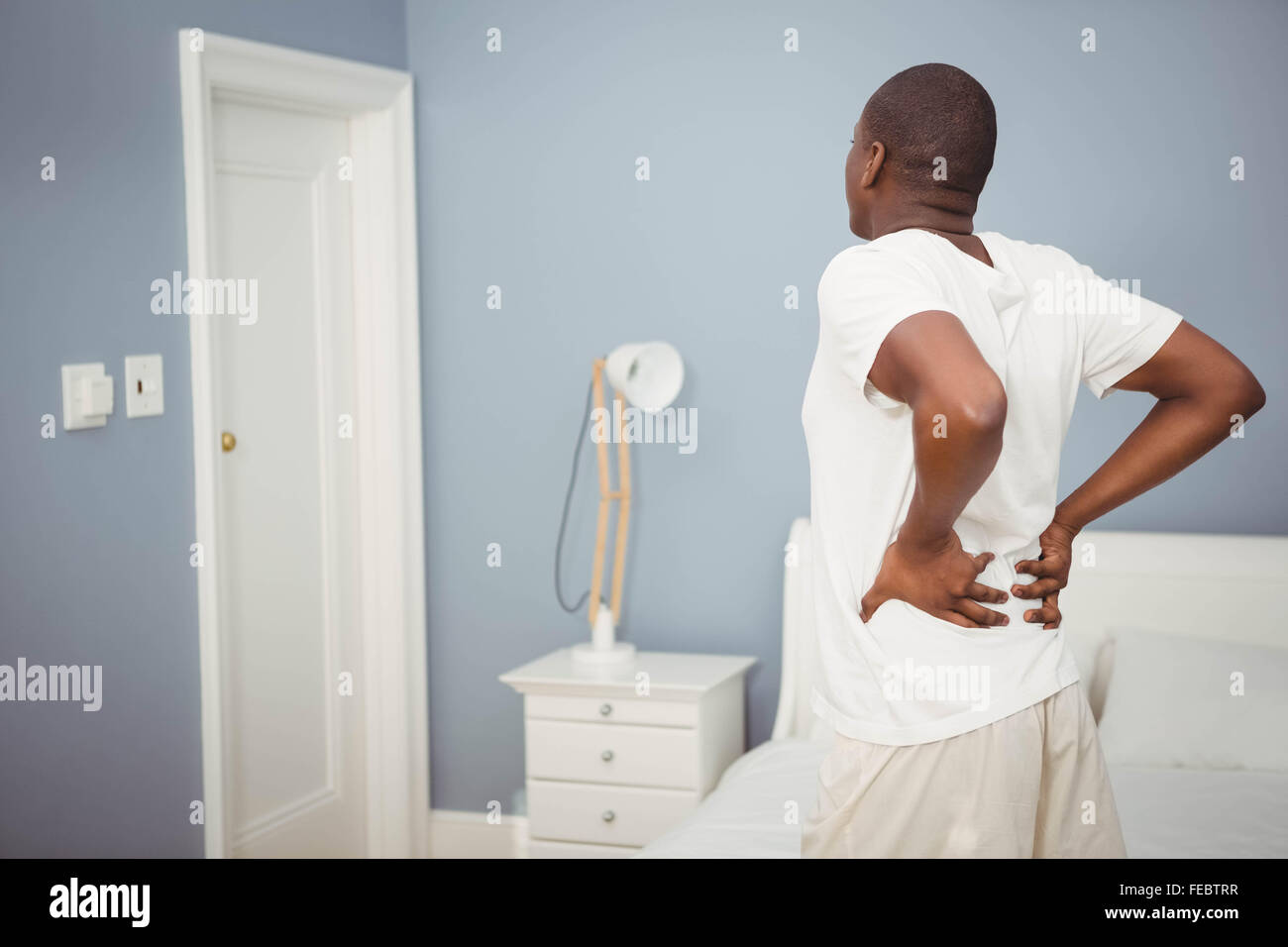 Man having back pain Stock Photo - Alamy