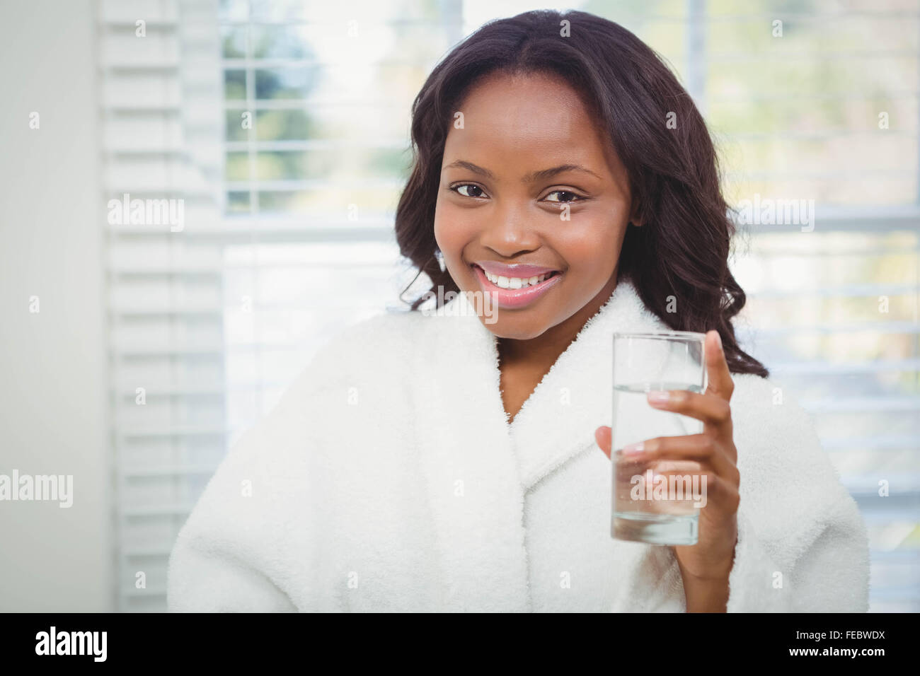 Beautiful woman drinking water Stock Photo - Alamy