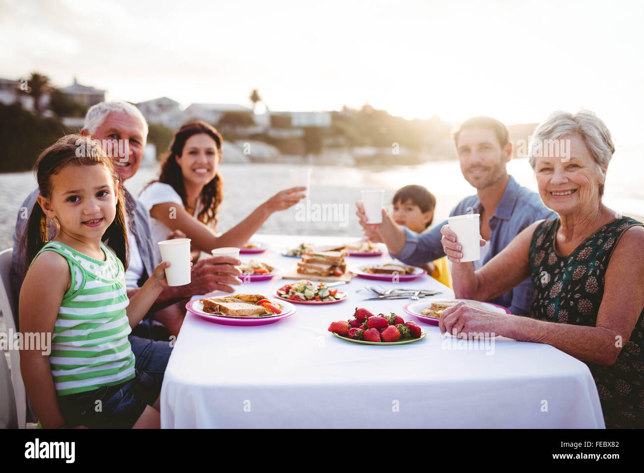 Cute family having dinner Stock Photo - Alamy