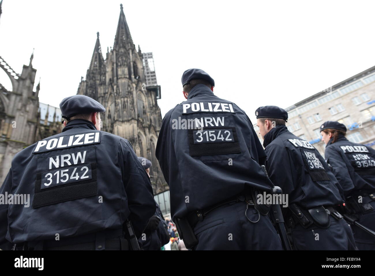 Cologne, Germany. 4th Feb, 2016. Police officers patrol the square in ...