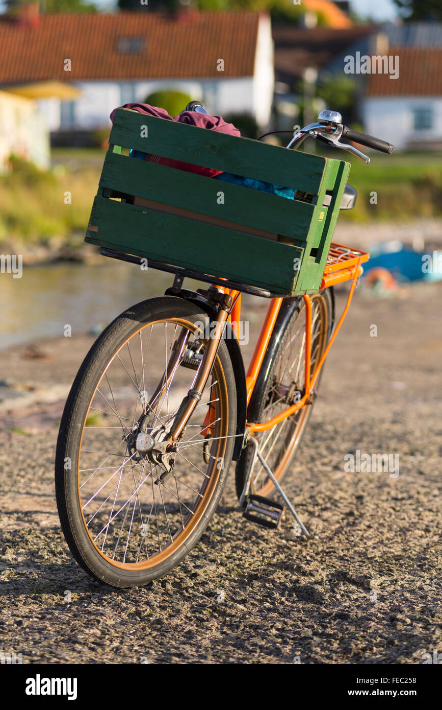 Orange vintage bicycle with green transport box in the harbor of the ...