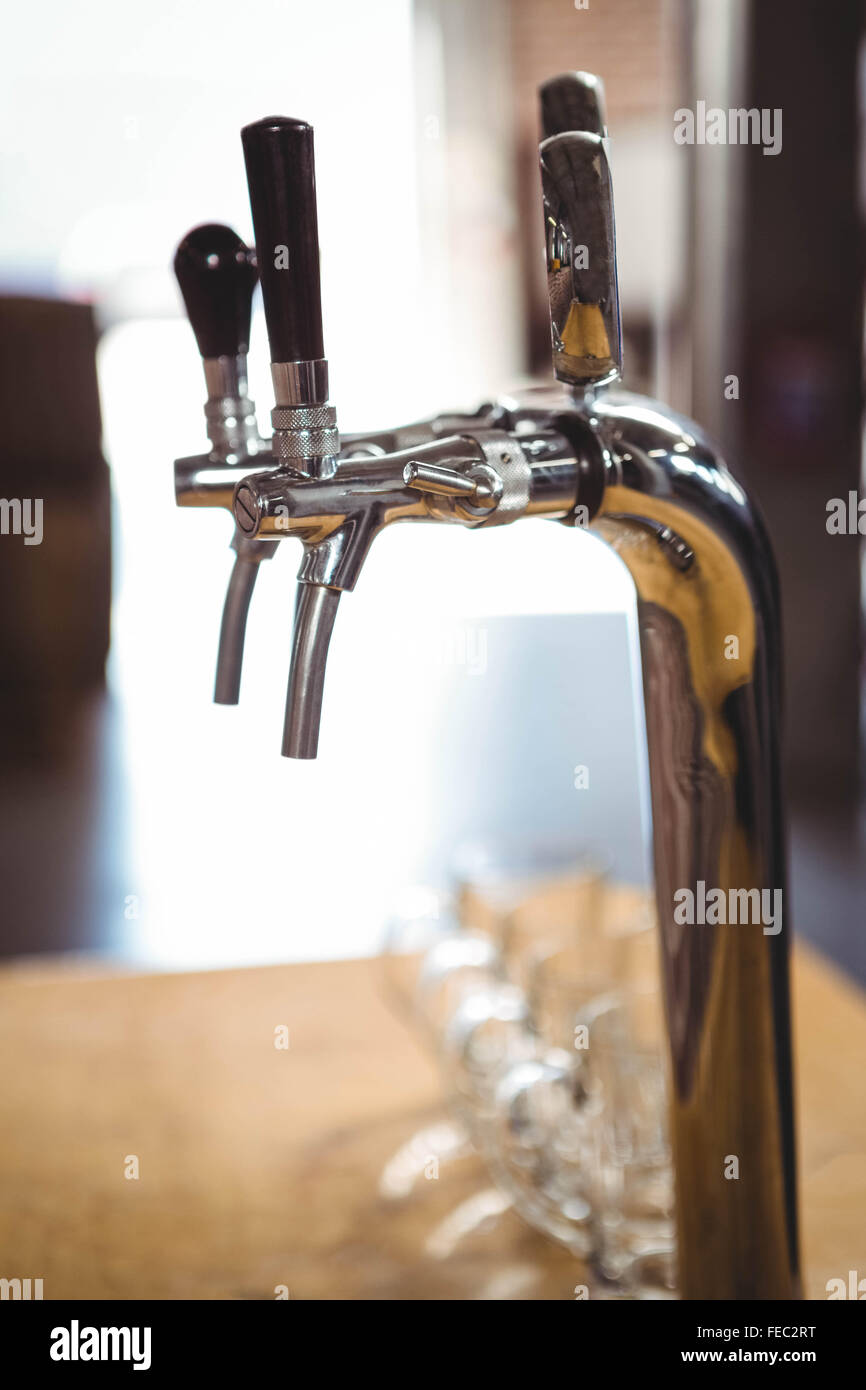 View of glasses and tap Stock Photo - Alamy